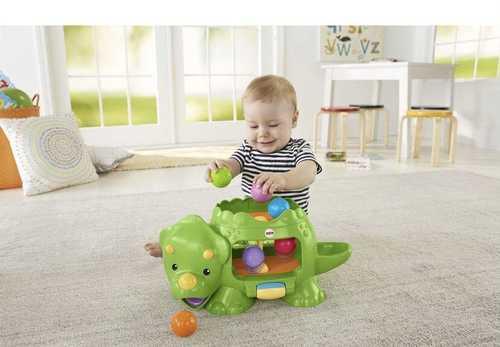 Игрушка Динозавр Fisher Price с шариками