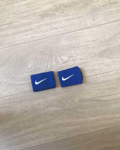 Держатели Nike для щитков