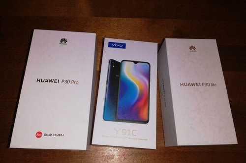 Три коробки от сотовых телефонов Huawei и Vivo