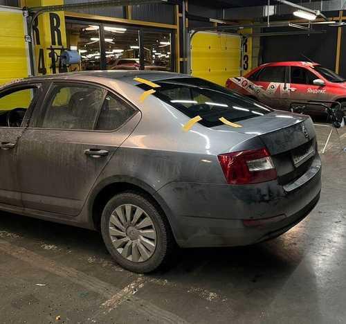 Заднее стекло на Skoda Octavia