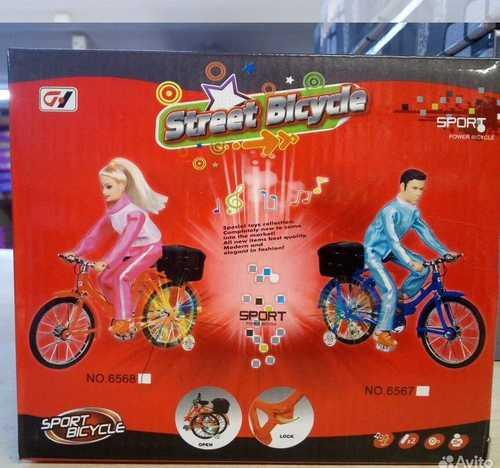 Кукла для девочек на велосипеде