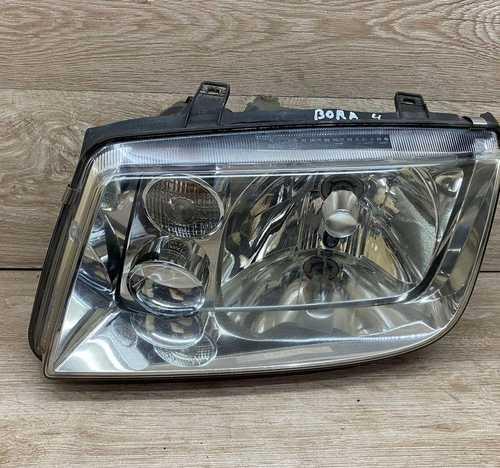 Фара передняя левая Volkswagen Bora 142856
