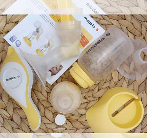 Молокоотсос medela ручной + соска calma новая