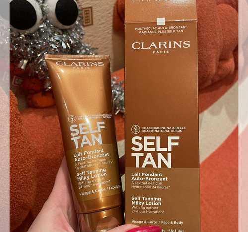 Clarins молочко с эффектом загара