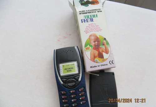 Мобильный телефон игрушка