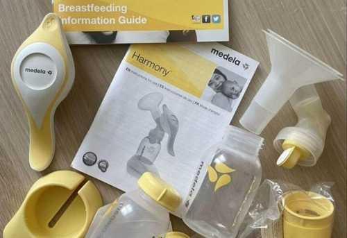 Молокоотсос medela ручной + пакеты для молока