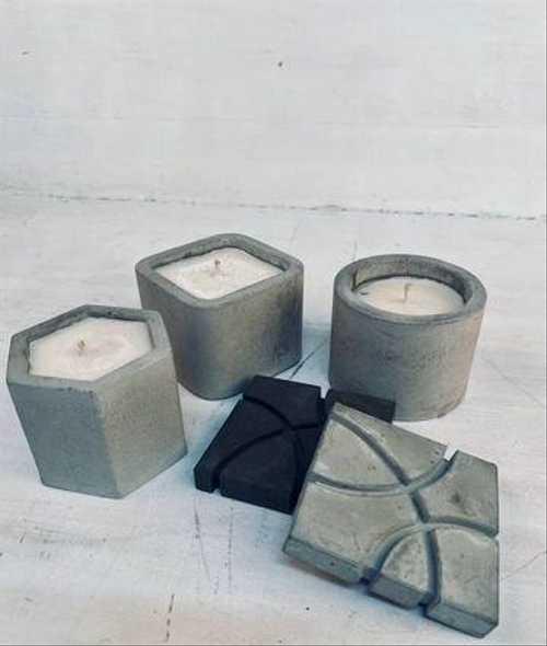 Большая свеча в подсвечнике из бетона и костер