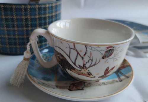 Чашка с блюдцем и чайные ложки