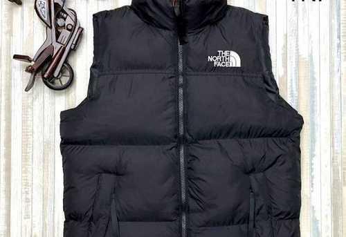 Жилетки The North Face разные цвета