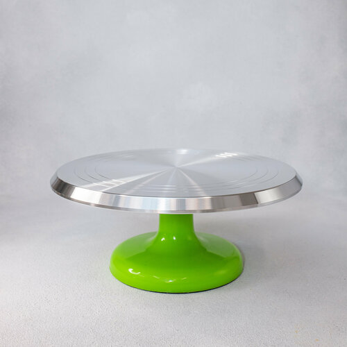 Поворотный металлический столик с зеленой ножкой