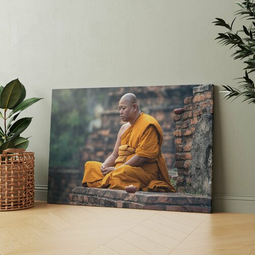 Картина на холсте "Монах сидит на скамейке перед зданием" 60x80 см. Интерьерная, на стену.